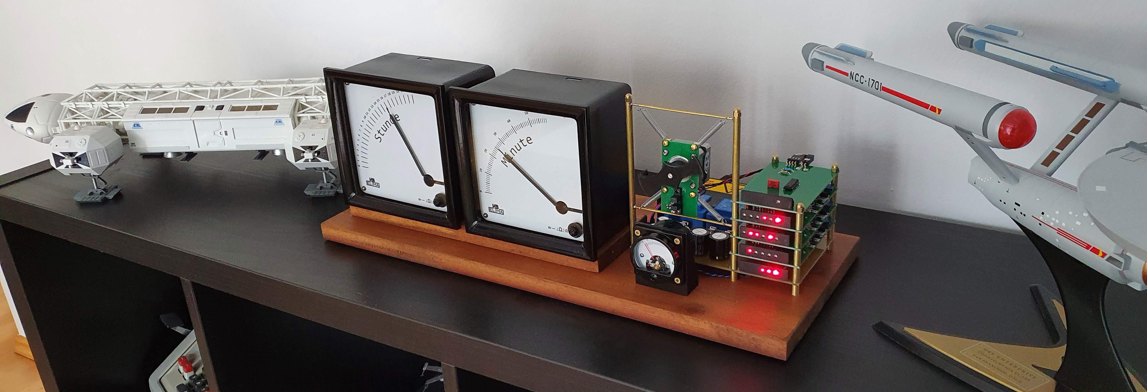 Electromechanicl analog digital clock
